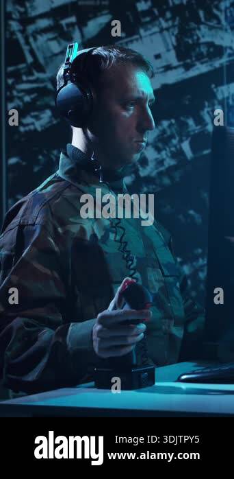 Soldier in a dimly lit military control room, intensely focused on ...