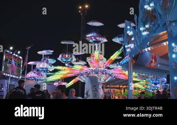 Girl walking along sandy beach by the river on a cool spring day ...