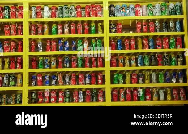 Girl walking along sandy beach by the river on a cool spring day ...