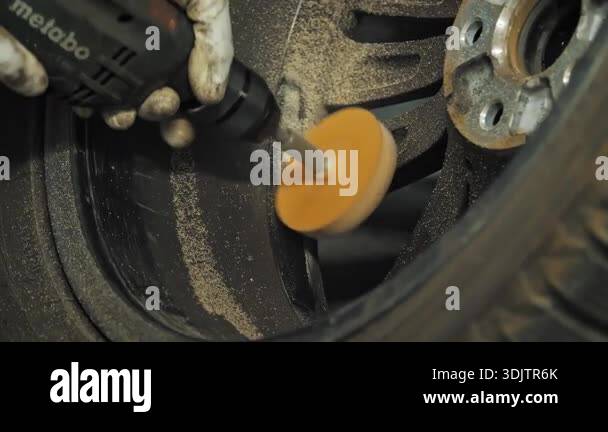 Automated machine brush polishing metal wheel rim during tire change ...