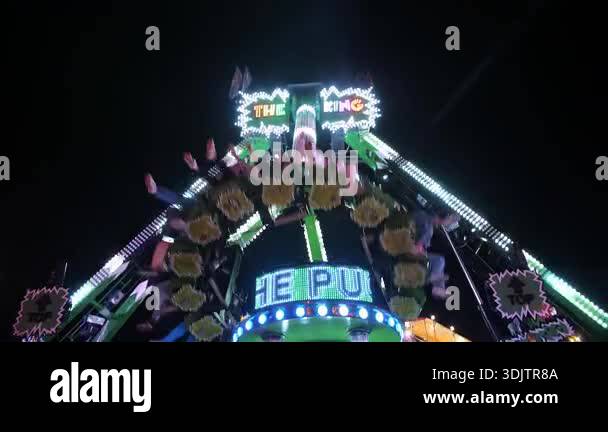Girl walking along sandy beach by the river on a cool spring day ...