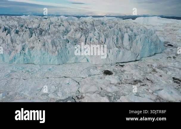 Massive Arctic glacier wall and ice field in Greenland, aerial polar ...