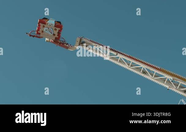 Thrilling pendulum attraction in motion at a theme park. Extreme ...