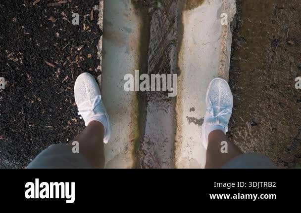 Ecological drainage system in Alpine park for rain protection. Tourist ...