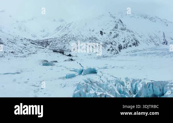 Arctic glacier and snowy mountains in Greenland with ice blocks and ...
