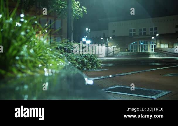 Powerful lightning strike illuminating night city sky during heavy ...