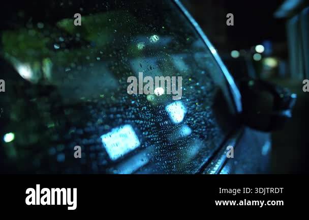 Powerful lightning strike illuminating night city sky during heavy ...