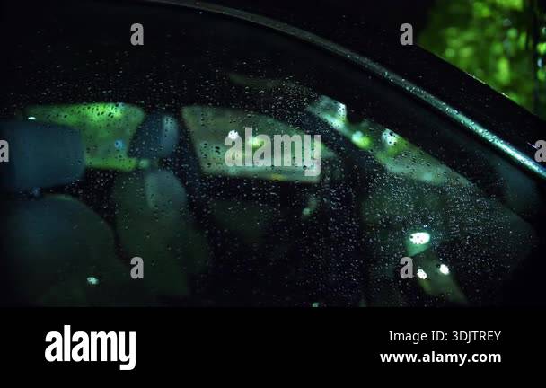 Powerful lightning strike illuminating night city sky during heavy ...