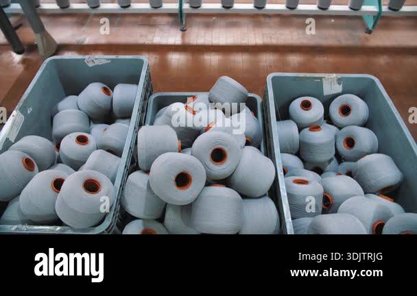 Specialized industrial basket loaded with thread reels for automated ...