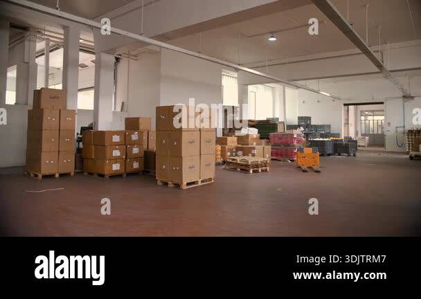 Spacious warehouse interior of textile plant featuring automated ...