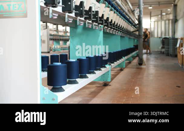 Heavy textile equipment performing yarn making processes on an ...