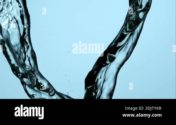 Two thick streams of clean clear water flowing downwards and merging ...