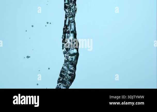 Dynamic splash of clean transparent water bursting and falling in ...