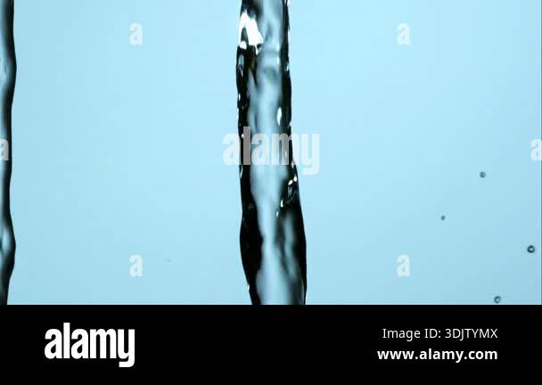 Two streams of clean transparent liquid water flowing downwards and ...