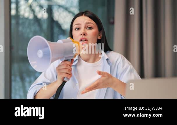 Woman passionately announces important news using megaphone. Expressive ...