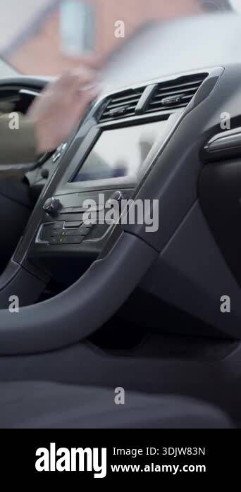 Close up of finger pressing car climate control button on modern ...