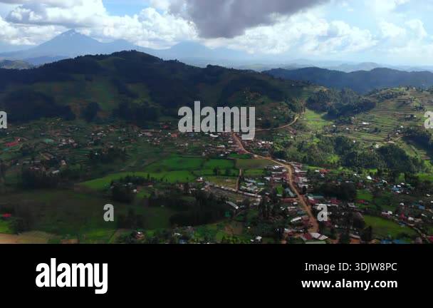 Cloudy Mountain Valley Town Aerial View, Sweeping Over Rooftops And ...