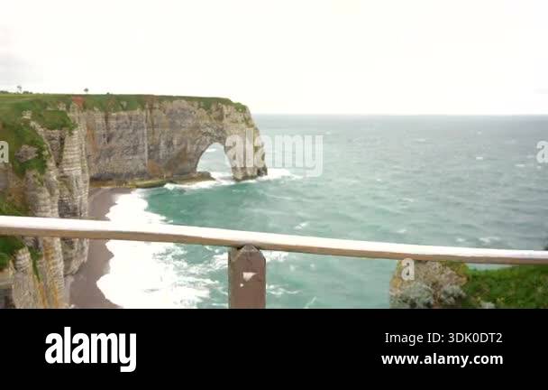 Scenic view of steep cliffs and natural sea arch on the coast of ...