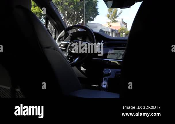 Interior of autonomous Waymo Jaguar I Pace taxi with empty drivers seat ...