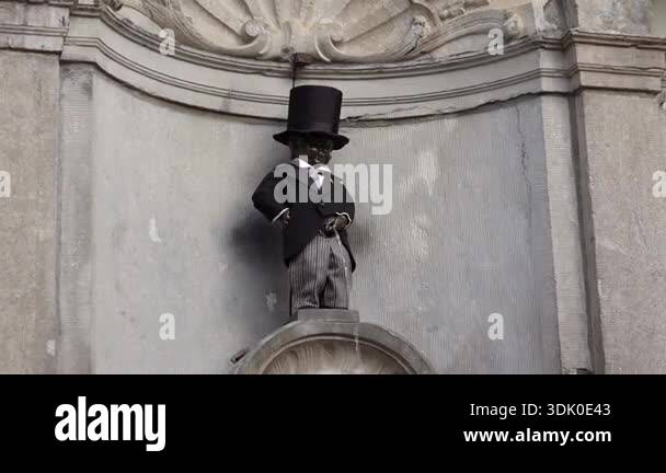 Close-up of the Manneken Pis statue in Brussels, Belgium, wearing a ...