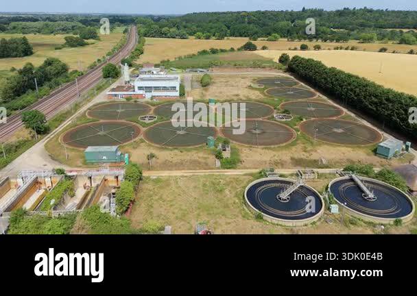 Aerial perspective of a large scale sewage treatment plant and water ...