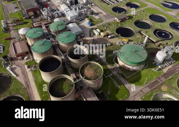 Aerial perspective of a large scale sewage treatment plant and water ...