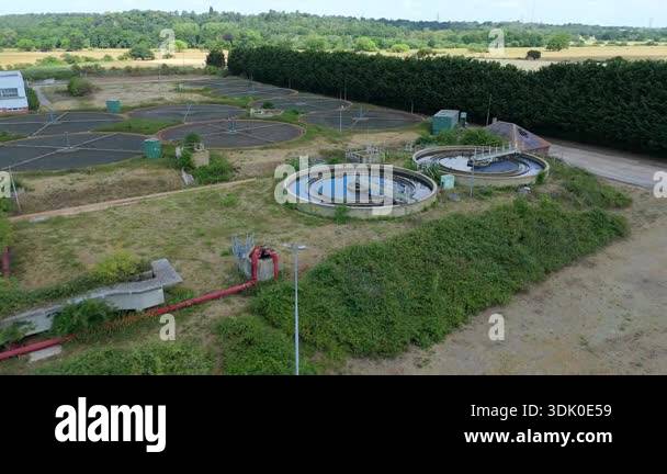 Aerial perspective of a large scale sewage treatment plant and water ...