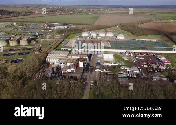 Aerial perspective of a large scale sewage treatment plant and water ...