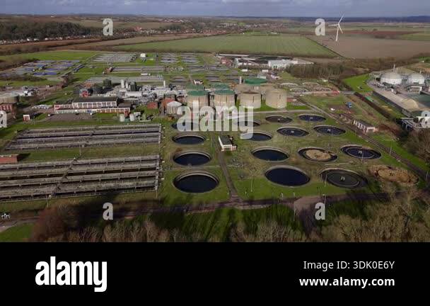 Aerial perspective of a large scale sewage treatment plant and water ...
