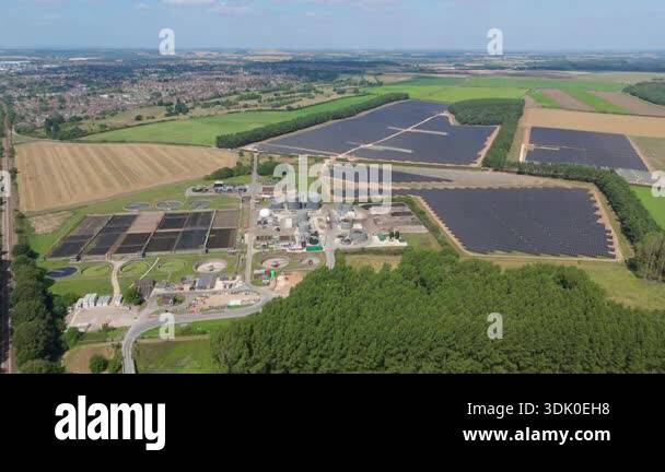 Aerial perspective of a large scale sewage treatment plant and water ...