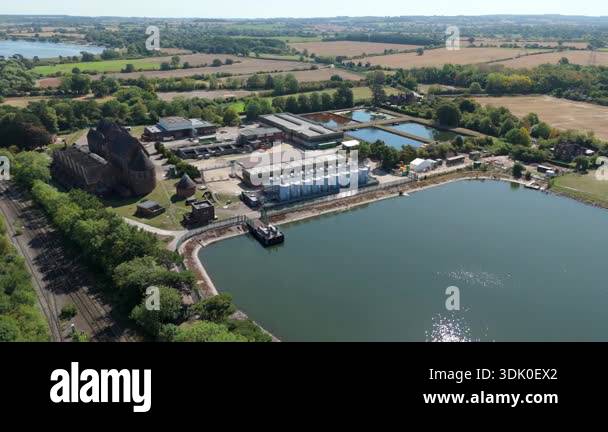Aerial perspective of a large scale sewage treatment plant and water ...