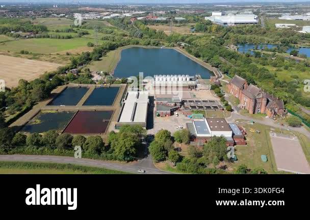 Aerial perspective of a large scale sewage treatment plant and water ...