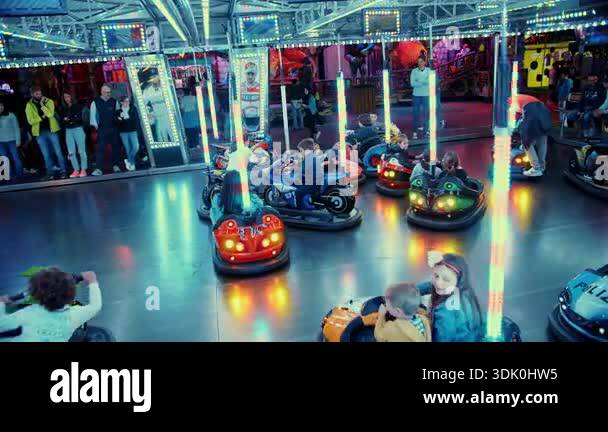 Panoramic view of bumper cars at nighttime amusement park in Biella ...