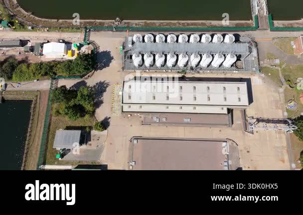 Aerial perspective of a large scale sewage treatment plant and water ...