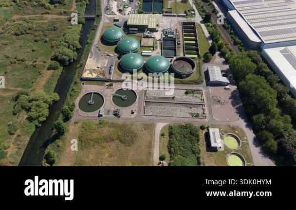 Aerial perspective of a large scale sewage treatment plant and water ...