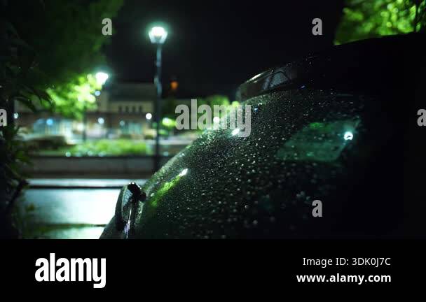 Rain. Light rainfall. Raindrops fall on the balcony railing. Close-up ...