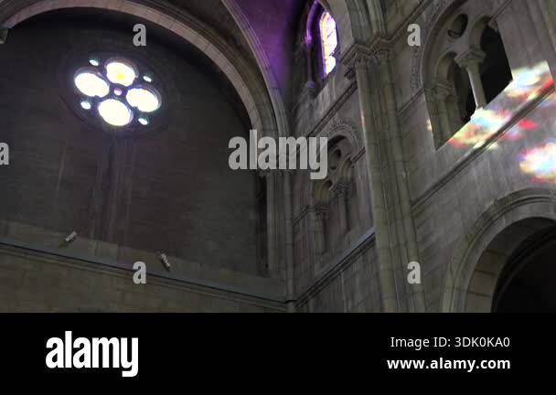 Calm church interior with arched architecture and colored reflections ...