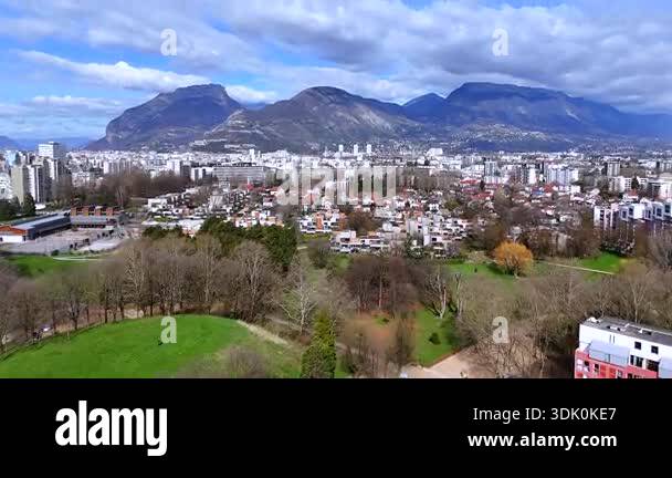 Drone panorama of Grenoble suburb with low rise homes high rise blocks ...
