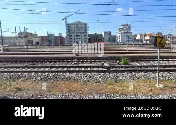 A train moves through Milan's railway tracks Stock Video Footage - Alamy