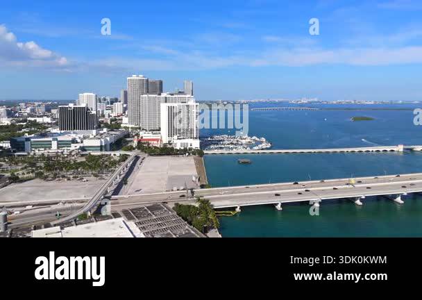 Miami Bay and downtown skyline with long highway bridge over turquoise ...