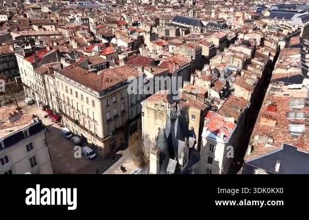 Drone video over historic Bordeaux city center with pointed spires ...