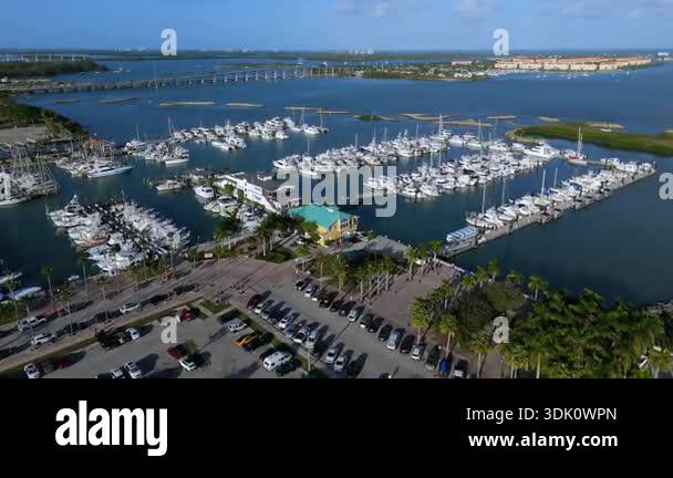 Aerial view of marina with luxury yachts boats calm coastal water and ...