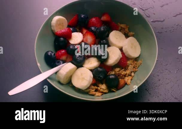 Person hands preparing delicious healthy muesli for breakfast Stock ...