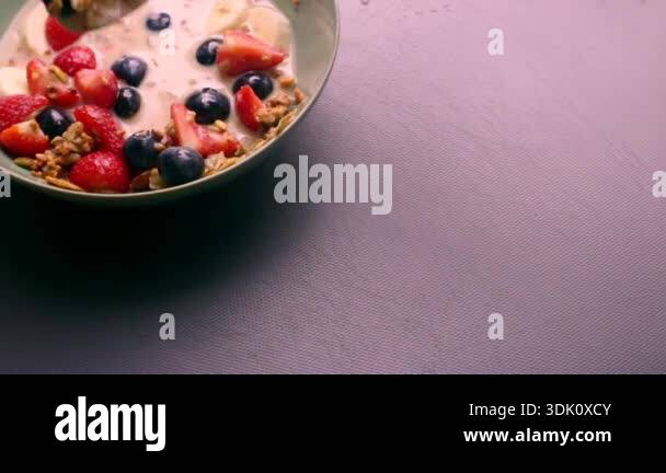 Person eating delicious healthy muesli cereal at breakfast time Stock ...