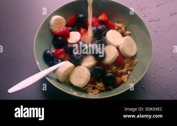 Person hands preparing delicious healthy muesli for breakfast Stock ...