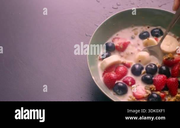 Person hands preparing delicious healthy muesli for breakfast Stock ...