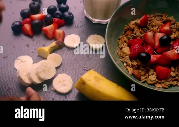 Person hands preparing delicious healthy muesli for breakfast Stock ...