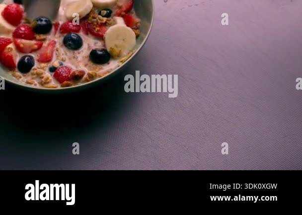 Person hands preparing delicious healthy muesli for breakfast Stock ...