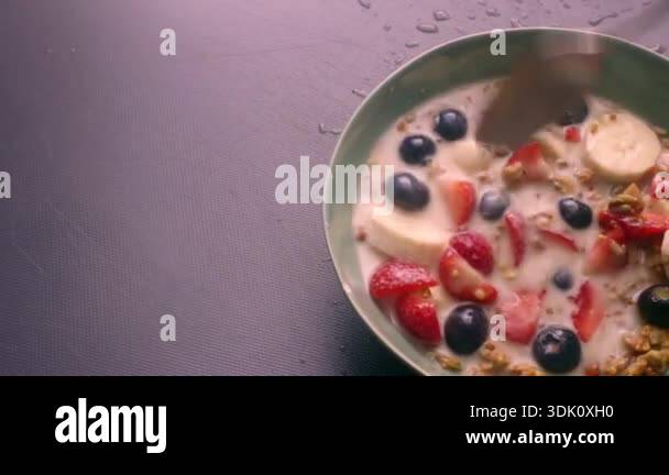 Person hands preparing delicious healthy muesli for breakfast Stock ...