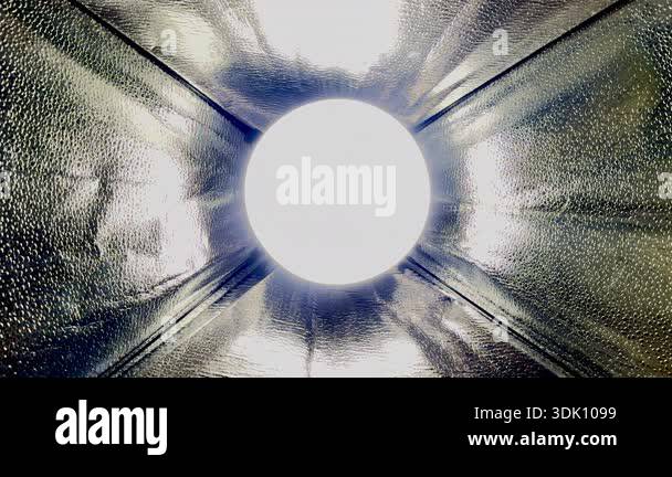 bright led light tunnel interior with reflective textured metal walls ...